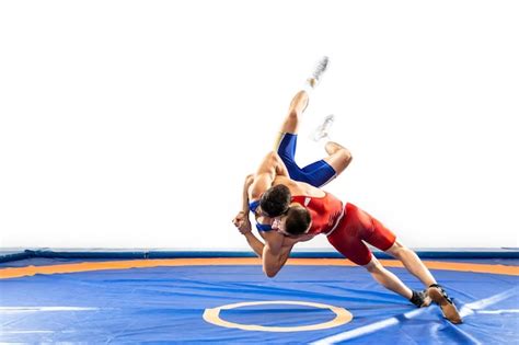 Premium Photo Two Strong Men In Blue And Red Wrestling Tights Are