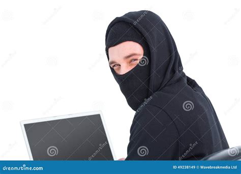 hacker using laptop and looking at camera stock image image of white