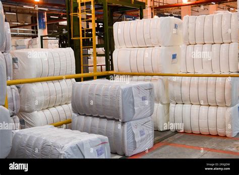 Warehouse With A Bunch Of Huge White Rectangular Bags With Acrylic