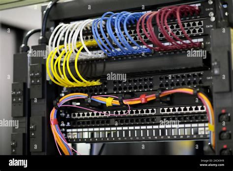 Network Data Rack With Mounted Networking Equipment Closeup Patch Cords And Patch Panels