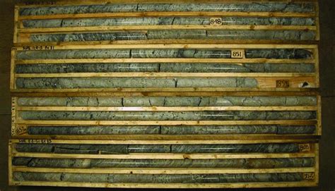 4 Photo Of Diamond Drill Core In Boxes Depth Of Hole Is Noted In