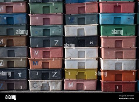 Colorful Plastic Boxes In Grid Pattern For Efficient Warehouse Storage