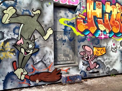 Graffiti With Cats And Mice On Building Wall