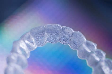 Premium Photo Close Up Of Dental Aligner Over Illuminated Background