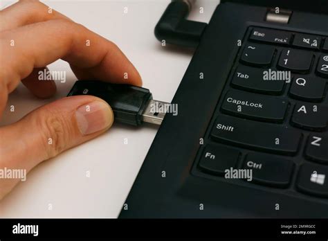 Person Plug In Usb Drive Into Laptop Port Stock Photo Alamy