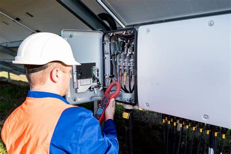 The Inspector Checks The Actual Output Voltage Level Of Inverter Stock Photo Image Of Plant