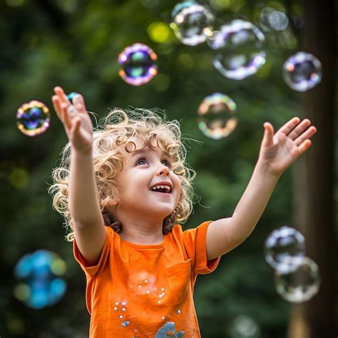Premium Ai Image Boy In Joyful Moment Capturing Bubbles Ai Generated
