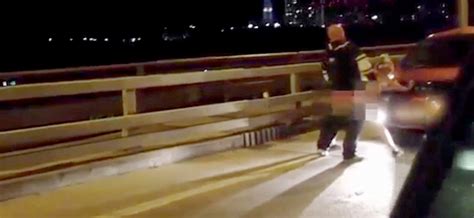 Randy Couple Are Caught Having Sex In The Middle Of A Road Bridge As Overexcited Passers By