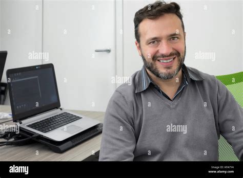 Happy Young Business Man Software Developer Computer Technician Working In Modern Office Of A