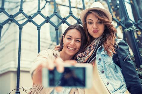Premium Photo Two Girls Doing Selfie