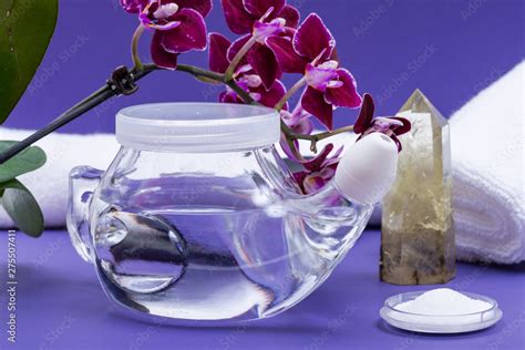Neti Pot Saline Orchid Flowers Rolled Up White Towels And Polished Citrine Quartz Point On