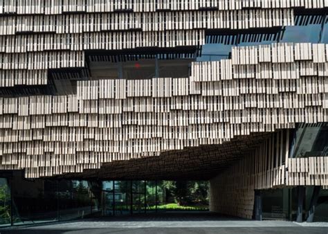 kengo kuma creates facade of wooden strips for university