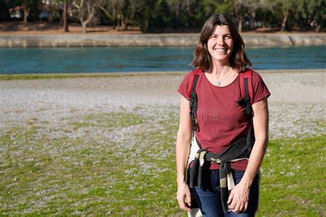 Middle Aged Woman Walking Outdoor In Summer River Park Stock Image
