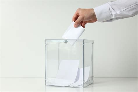 Premium Photo Voting Box With Papers And Male Hand On White Background Premium Photo Voting Box With Papers And Male Hand On White Background