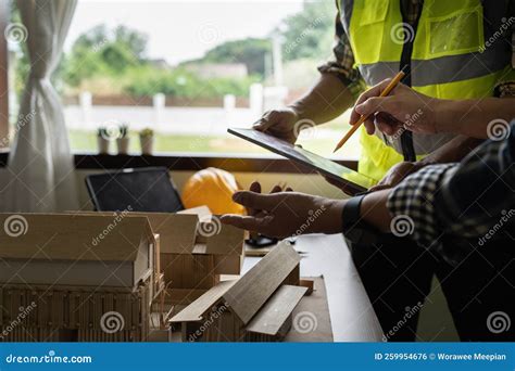 Architect Man Working With Blueprints For Architectural Plan Engineer Sketching A Construction