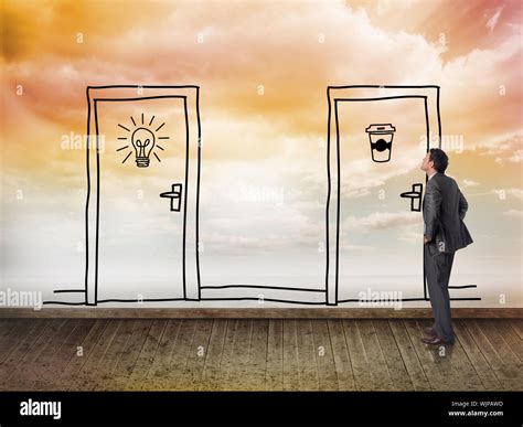 Smiling Businessman With Hands On Hips Against Two Doors On Wall With