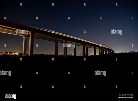 Trestle Bridge With A Motion Effect Surrounded By Lights And Greenery