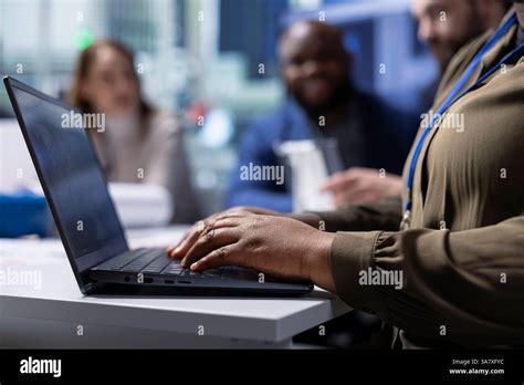 Photovoltaics Factory Worker Analyzing Data Reviewing System Health Metrics With Laptop Solar