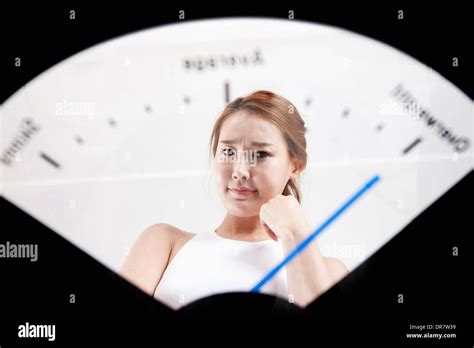 A Woman In Weighing Scale Stock Photo Alamy