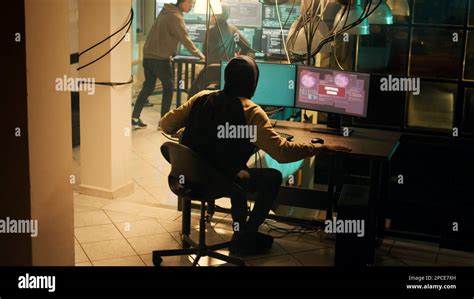 skilled hacker successfully cracking security network on computer doing hacking and espionage