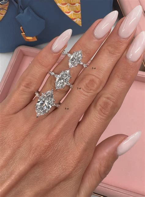 Marquise Cut Diamond Engagement Ring With Hidden Halo