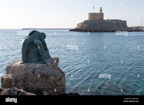 Bronze Statue Of Sleeping Eros At The Entrance To Mandraki Harbor Stock