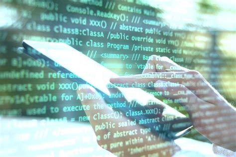 Premium Photo Hand Using Digital Tablet And Abstract Coding Text