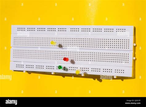 Light Emitting Diode Or LED On A Electronic Breadboard For Projects In Engineering And Testing