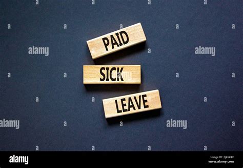 Paid Sick Leave Symbol Concept Words Paid Sick Leave On Wooden Blocks Beautiful Black Table