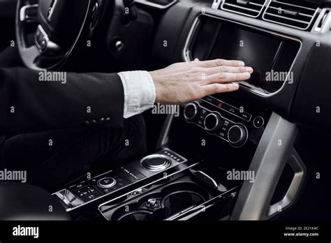 Close Up Of Man Turning On Stereo System While Driving His Car Transportation And Vehicle