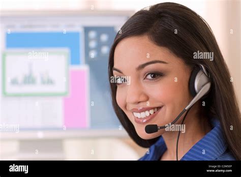 Smiling Woman With Headset And Computer Monitor Stock Photo Alamy