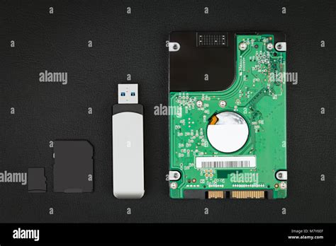 Hard Disk Usb Flash Drive SD Card And Micro SD On The Black Workstation Development Of IT