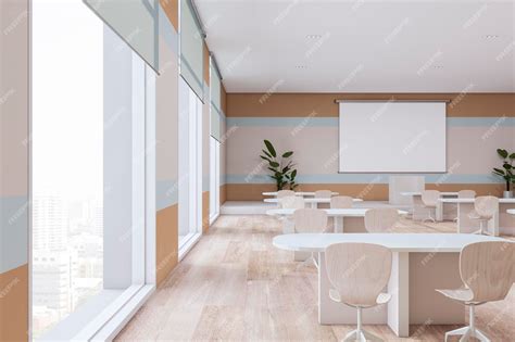 벽 책상 나무 바닥에 빈 흰색 모의 배너와 도시 전망 교육 및 강당 개념 3d 렌더링이 있는 창문이 있는 현대적인 학교 교실