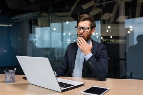 Premium Photo Mature Bored Businessman Working Inside Modern Office