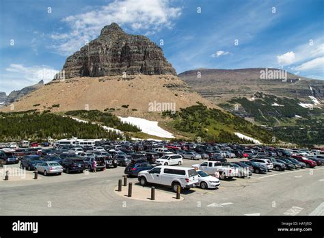 The Logan Pass Parking Lot In Glacier National Park Serves As A Gateway