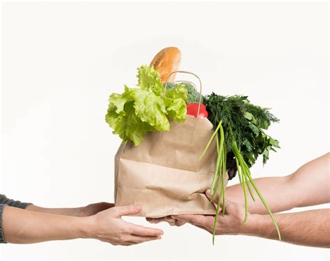 Premium Photo Front View Of Pair Of Hands Holding Grocery Bag