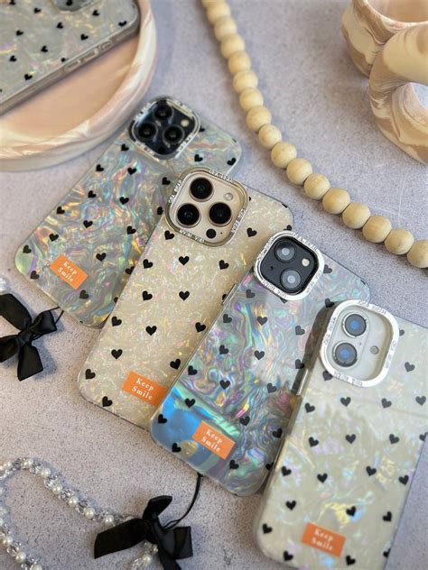 قاب طرح ماربل قلب ریز با آویز گوشی آیفون 16