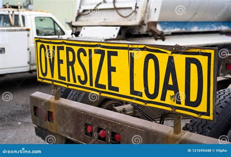 Oversize Load Sign On The Back Of Big Rig Semi Truck Tractor On Stock