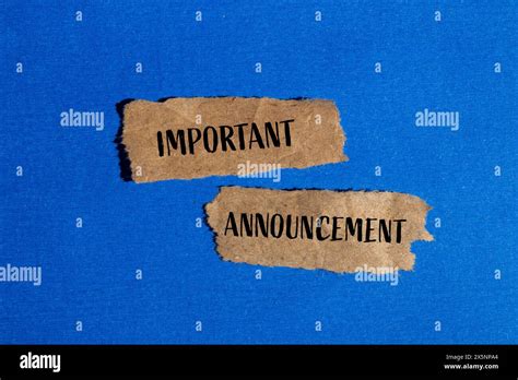 Important Announcement Words Written On Torn Brown Paper Pieces With