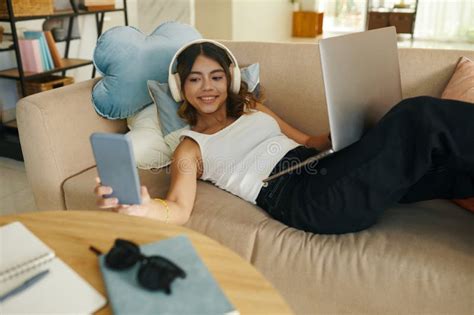 Girl Checking Notifications On Phone When Studying Stock Image Image