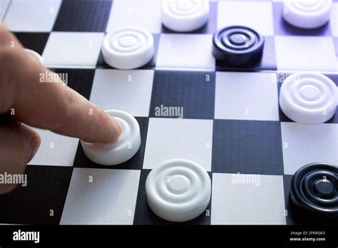 Board Game Of Checkers Black And White Chips For The Game Chess Field