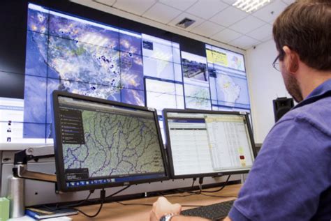 Control Room Operator Visualising Data From Iot Weather Sensors