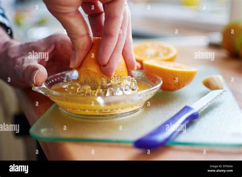 Man orange hand squeezing hi-res stock photography and images - Alamy