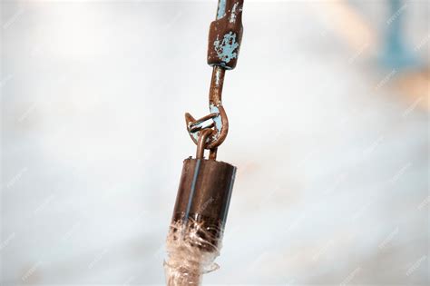 Premium Photo Old Rusty Metal Hook Mount Old Rusty Hook Closeup On A Blurred Background Rusty