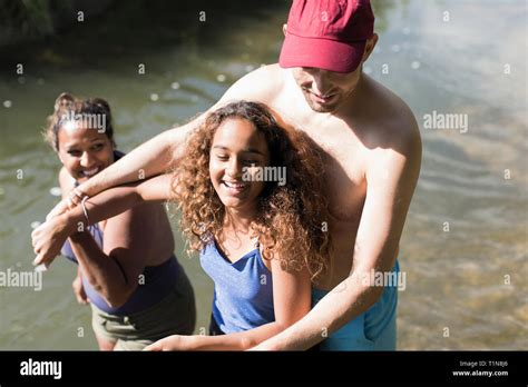 Happy Family Playing In River Stock Photo Alamy