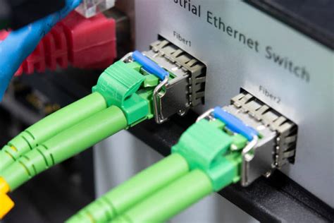 50 Network Switch And Utp Ethernet Cables Close Up In Server Room