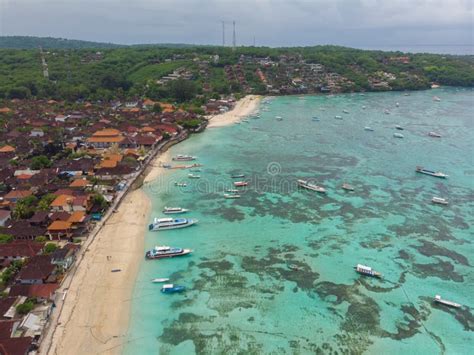 Coast Jungut Batu Village With Boats And Hotels On The Island Of Lembongan Indonesia Aerial