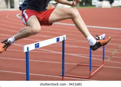 Man Jumping Over Hurdle Stock Photo Edit Now