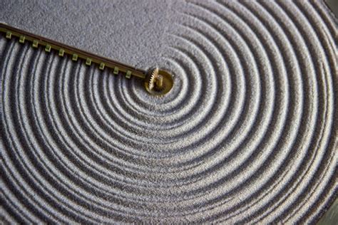 Studio Ayaskan Designs Clock That Rakes Sand To Show The Ripples Of Time