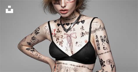 A Woman With Tattoos On Her Body Posing For A Picture Photo Free Grey